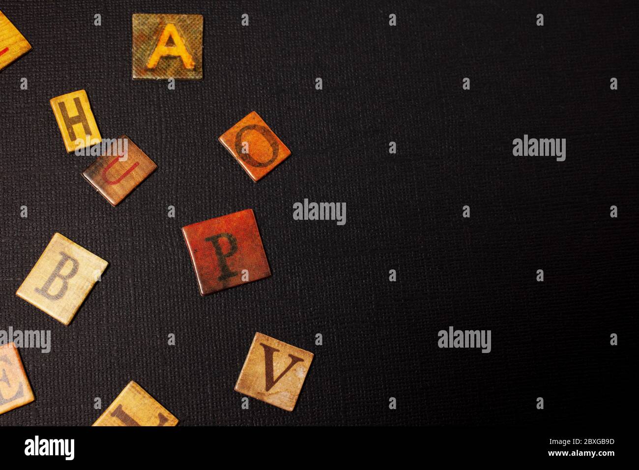 random letters of alphabet on black background with copy space Stock ...