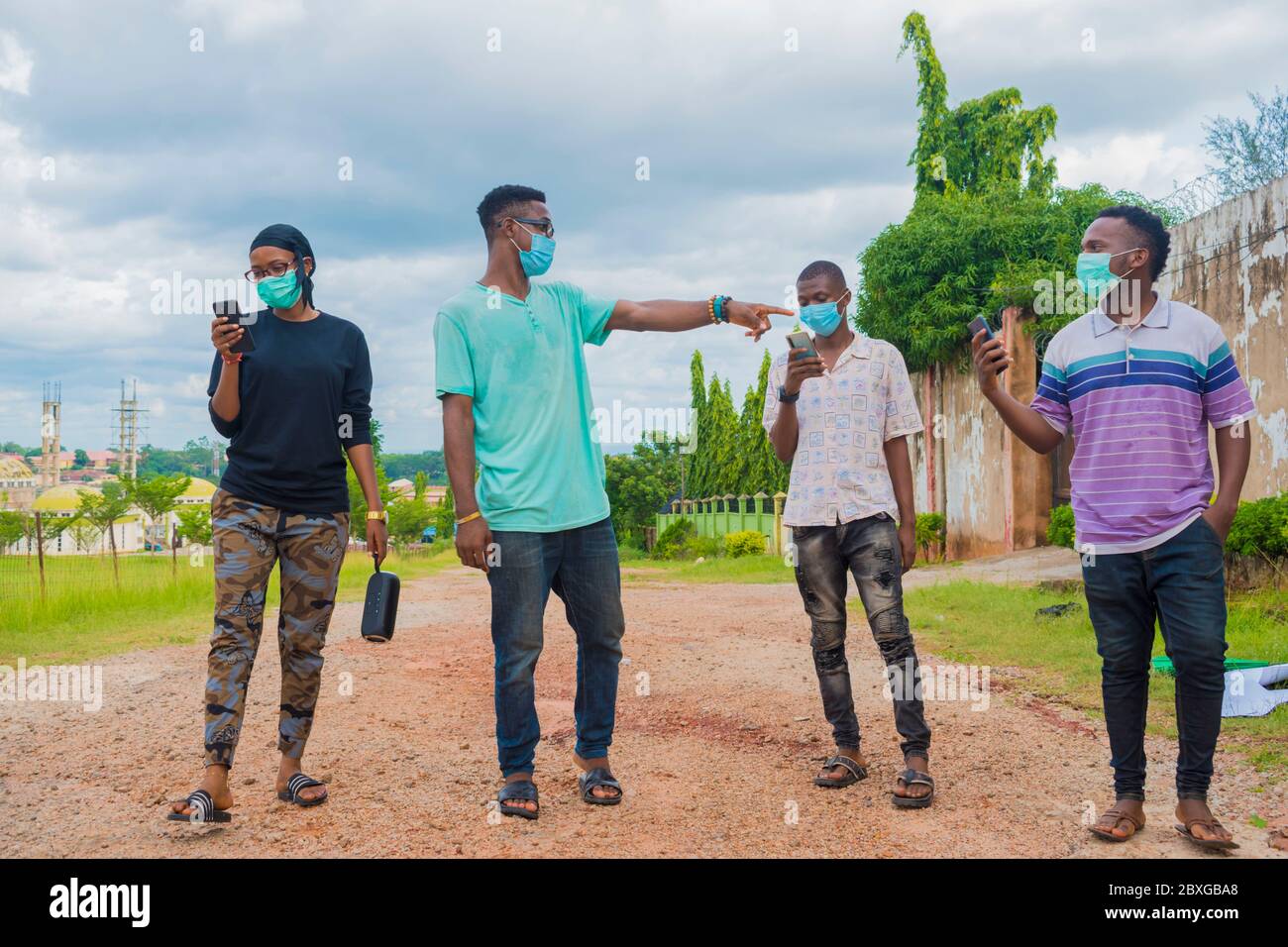 group of africans wearing face mask to prevent, preventing, prevented ...