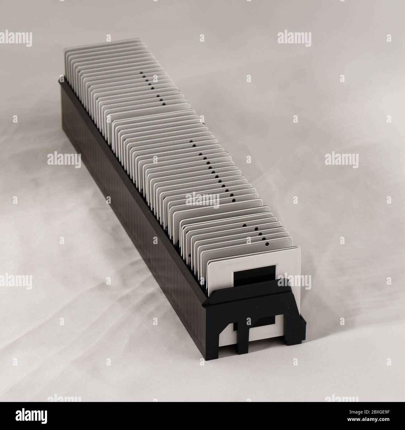 Photographic slides in a magazine tray, white background Stock Photo ...