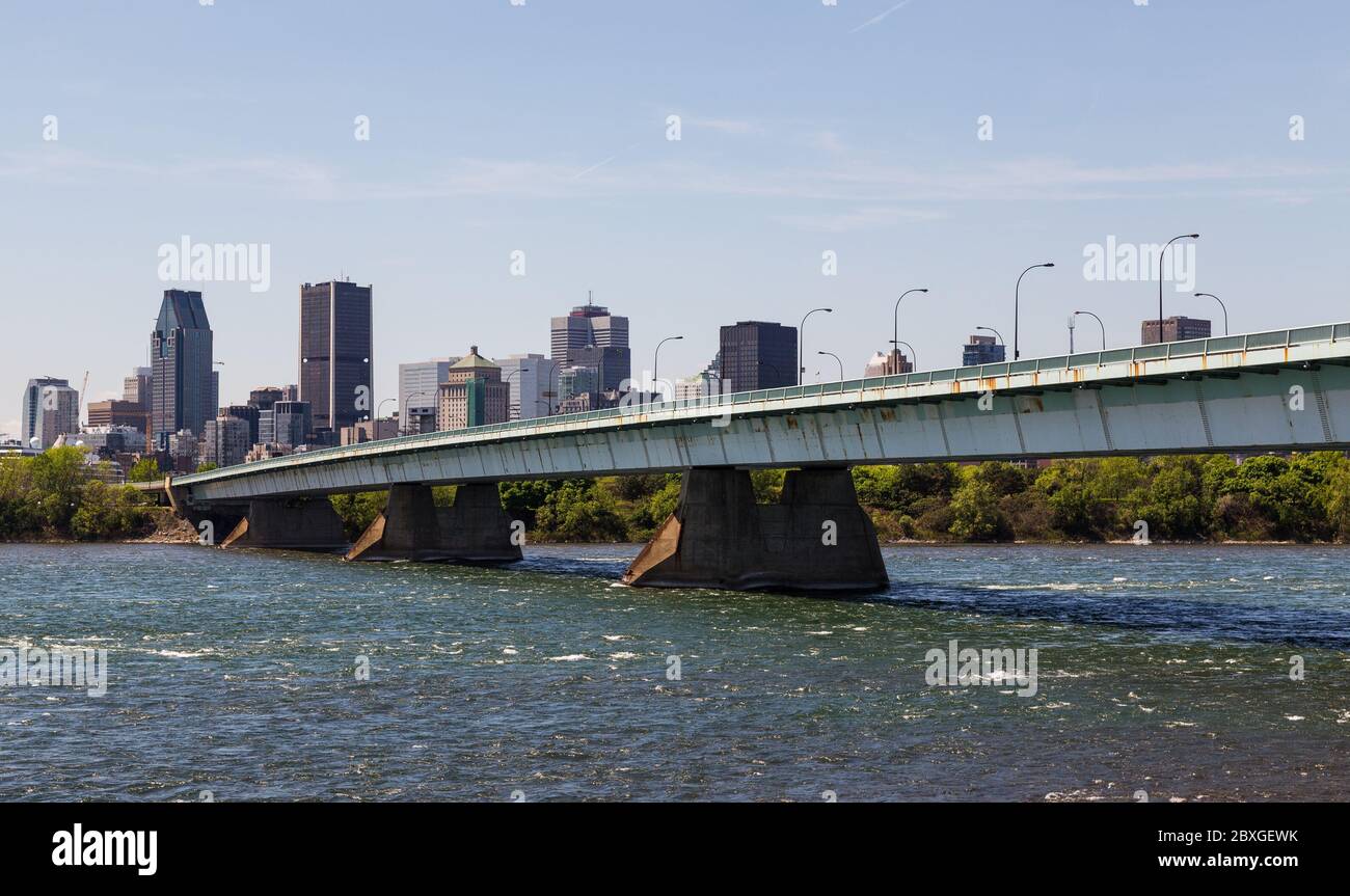 A view of downtown Montreal during the day showing the Pont de la ...