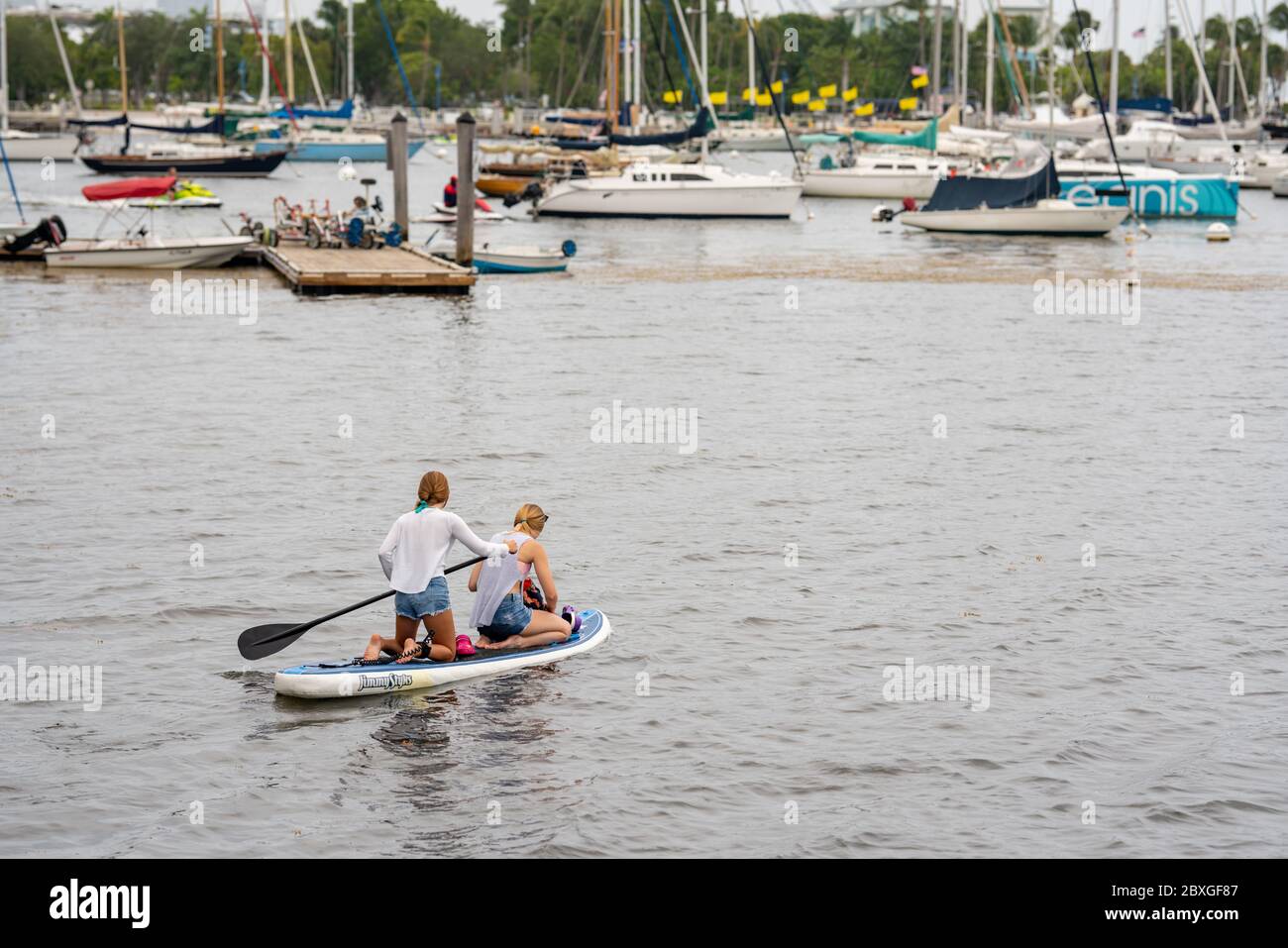 Two girls on paddle hi-res stock photography and images - Alamy