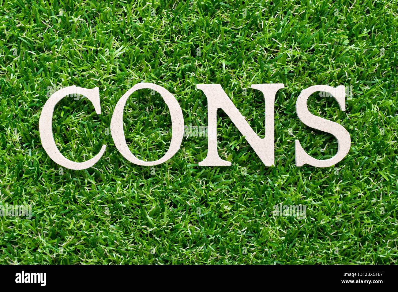 Wood alphabet in word cons on artificial green grass background Stock ...