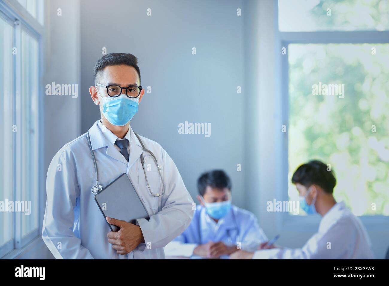Three doctors having a meeting Stock Photo - Alamy