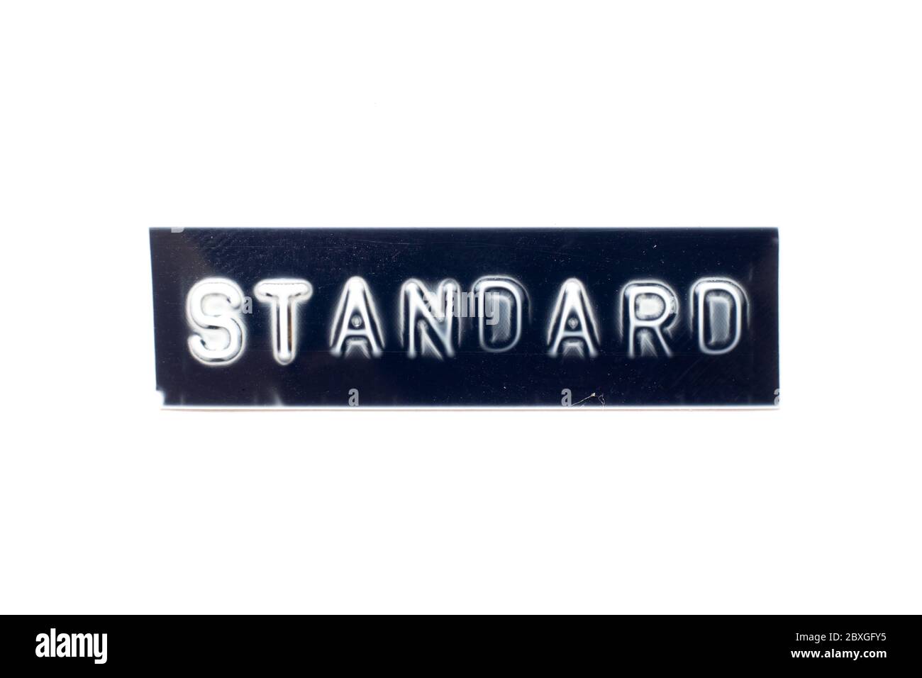 Embossed letter in word standard in black banner on white background ...
