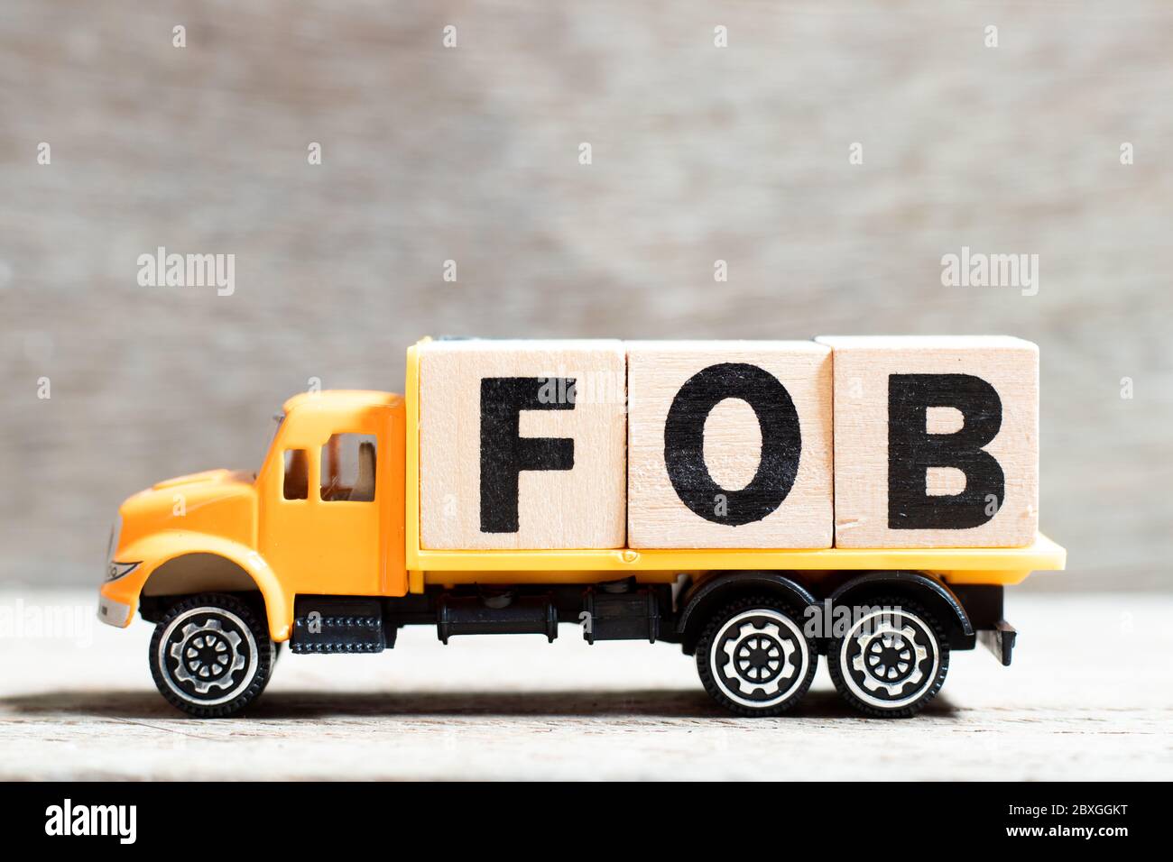 Truck hold letter block in word FOB (abbreviation of Free On Board) on ...