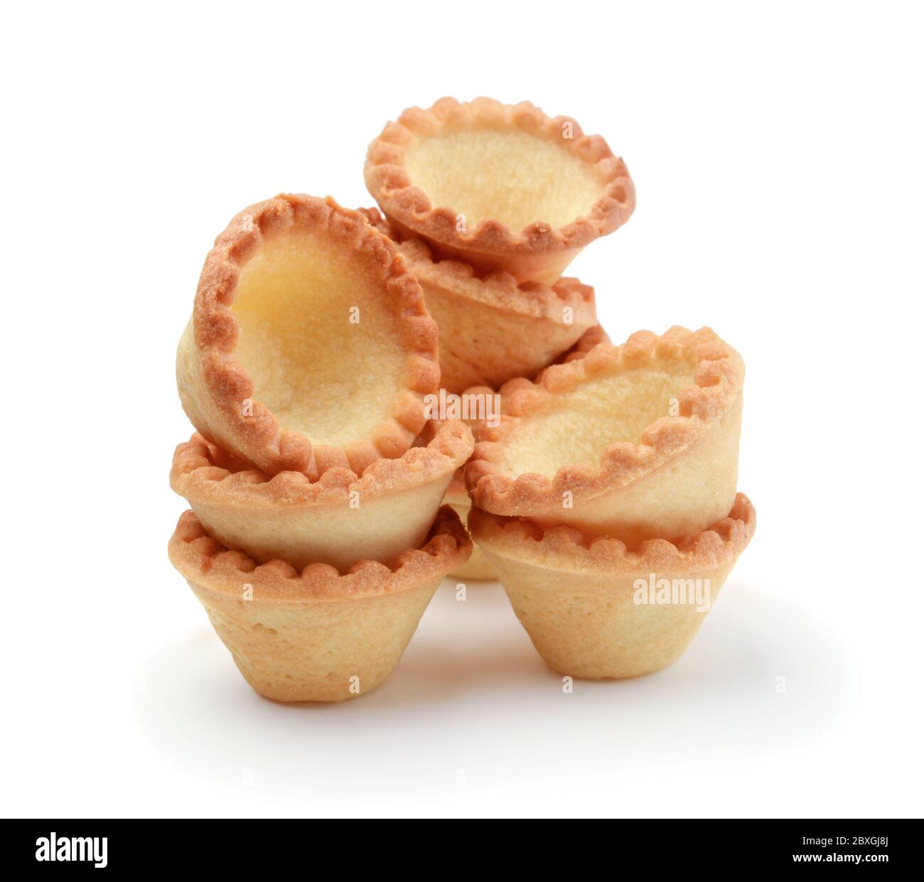 Group of small empty tartlets isolated on white Stock Photo - Alamy