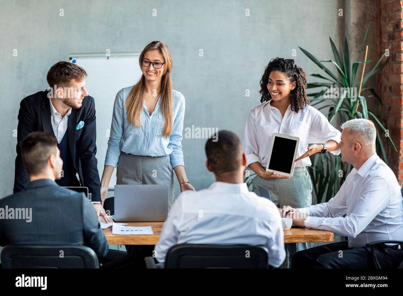 Coworkers Brainstorming Business Idea During Corporate Meeting In ...