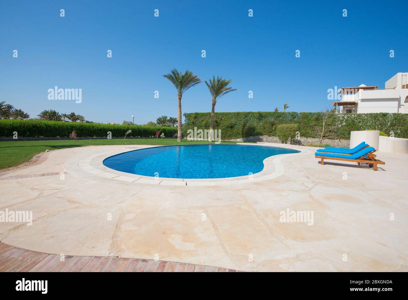 Luxury villa show home in tropical summer holiday resort with swimming ...