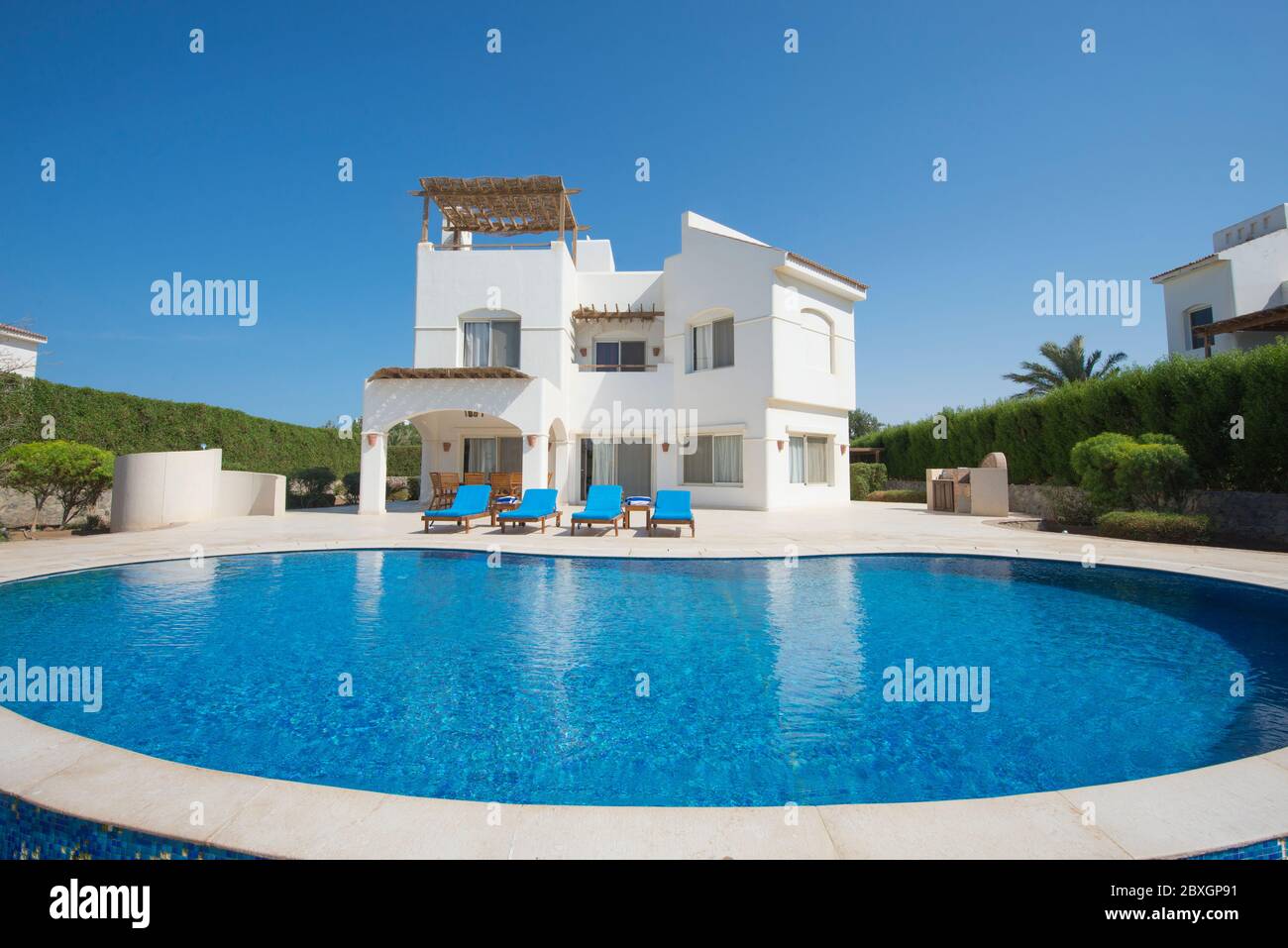 Luxury villa show home in tropical summer holiday resort with swimming ...