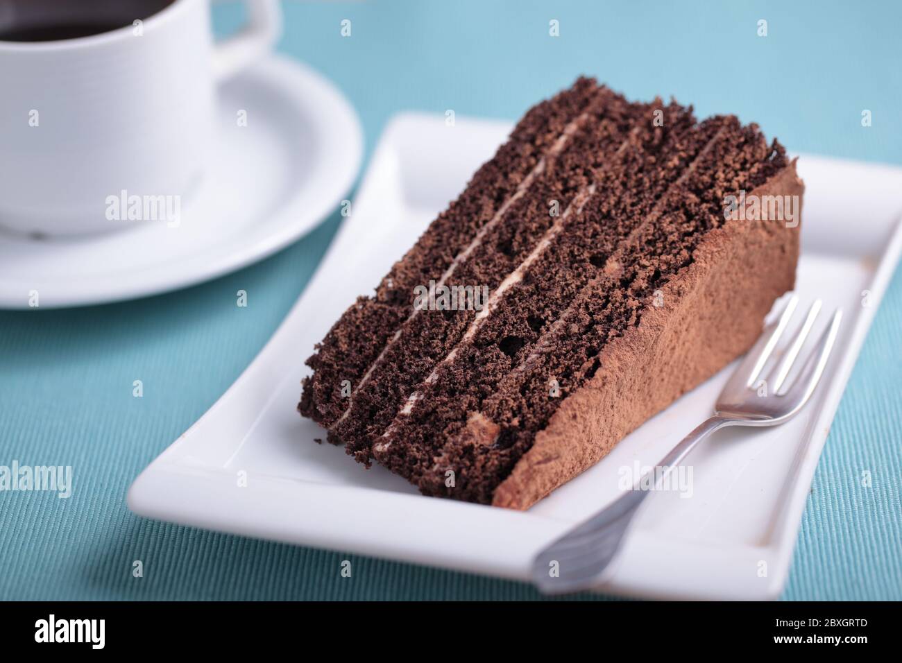 Coffee break: slice of chocolate cake and a cup of coffee Stock Photo ...