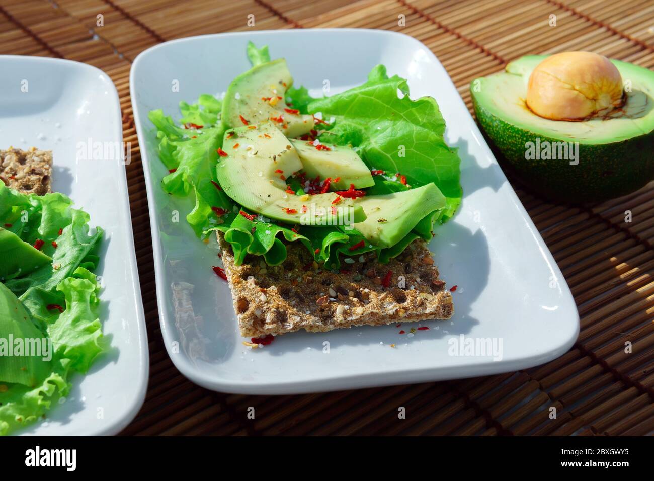 risp sandwich with avocado. Snack Bread and fiber food. Wheat crisp ...