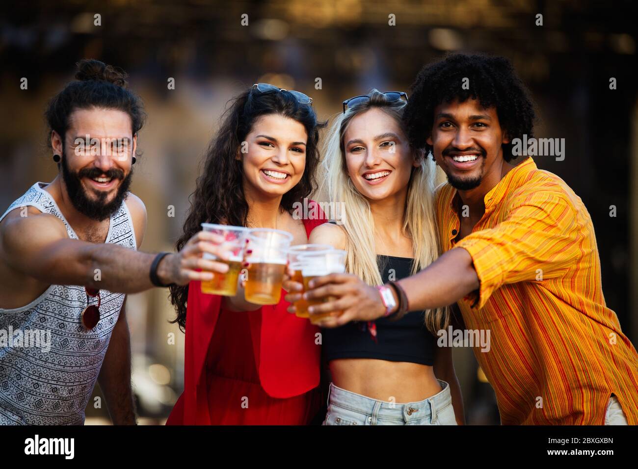 Group of happy friends people having fun together outdoors Stock Photo ...