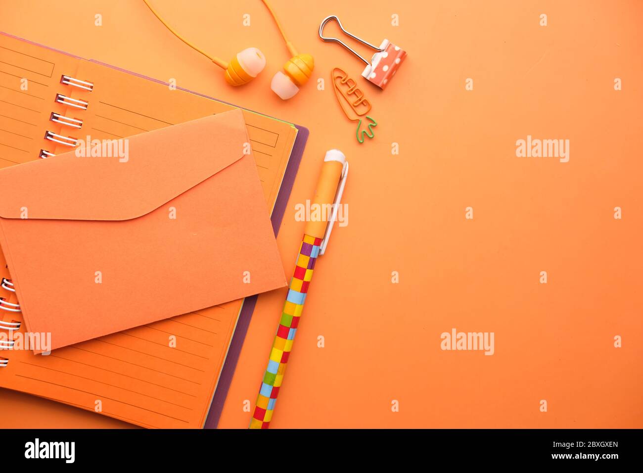 orange notepad, keyboard, pen and envelope with copy space Stock Photo ...