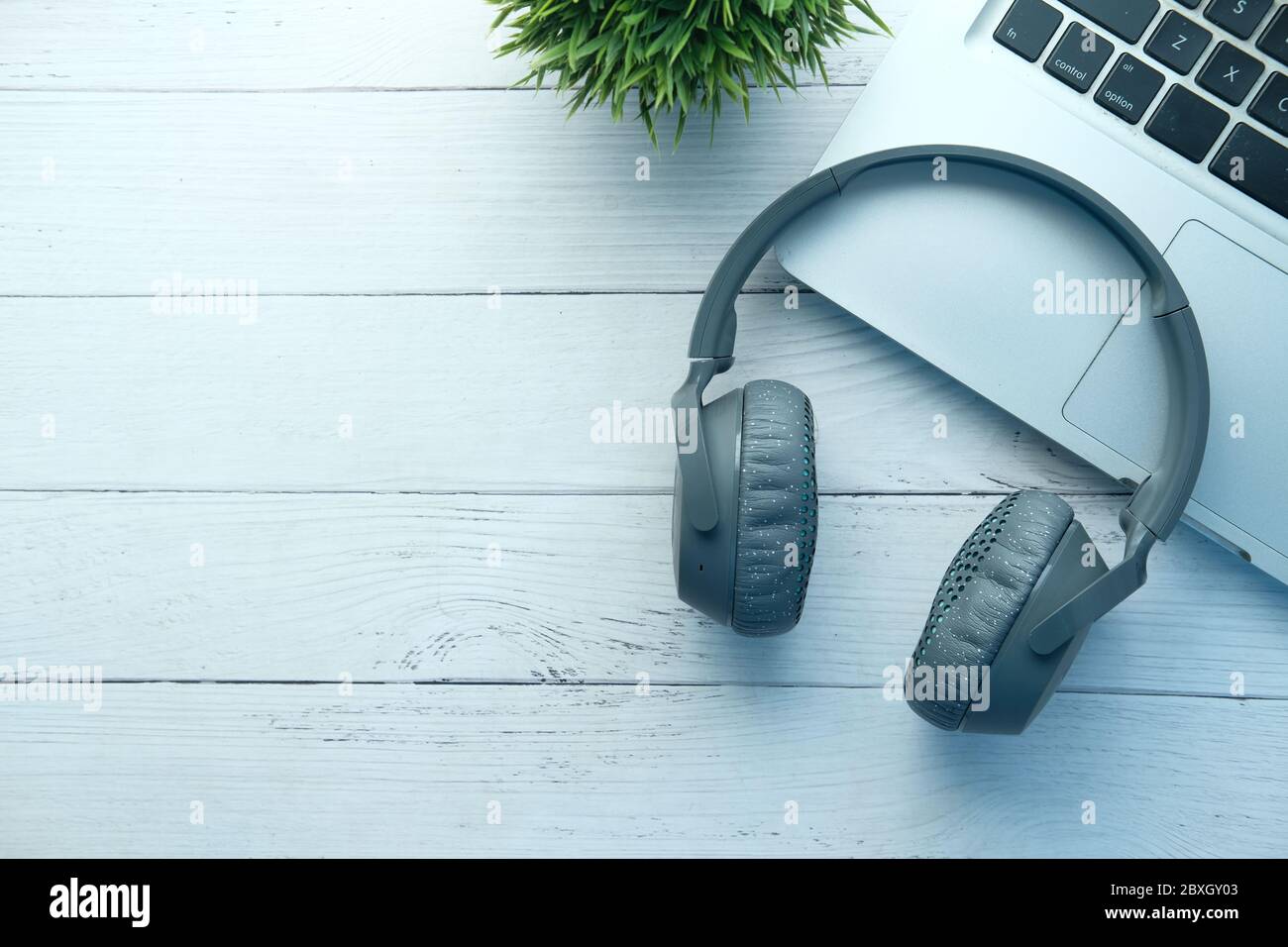 Headphone on laptop copy hi-res stock photography and images - Alamy
