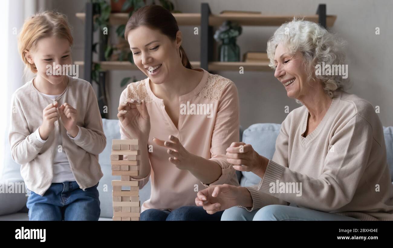 Happy three generations of women play at home together Stock Photo - Alamy