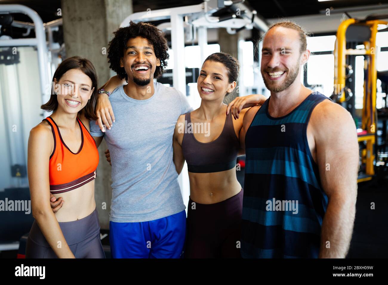 Beautiful fit people working out in gym together Stock Photo - Alamy