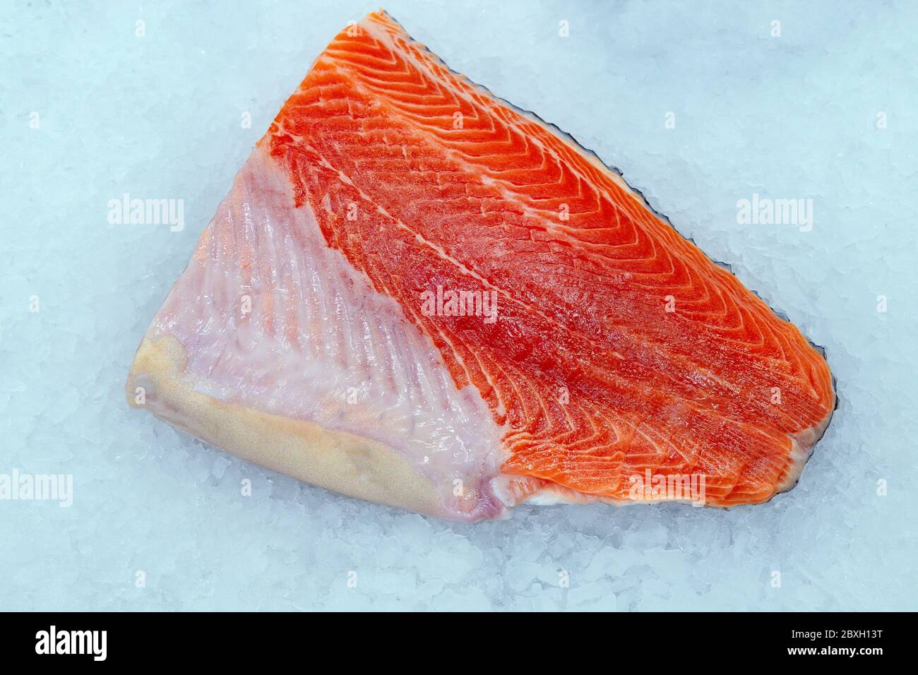 raw salmon meat is taken close-up. Sale of fresh red fish Stock Photo ...