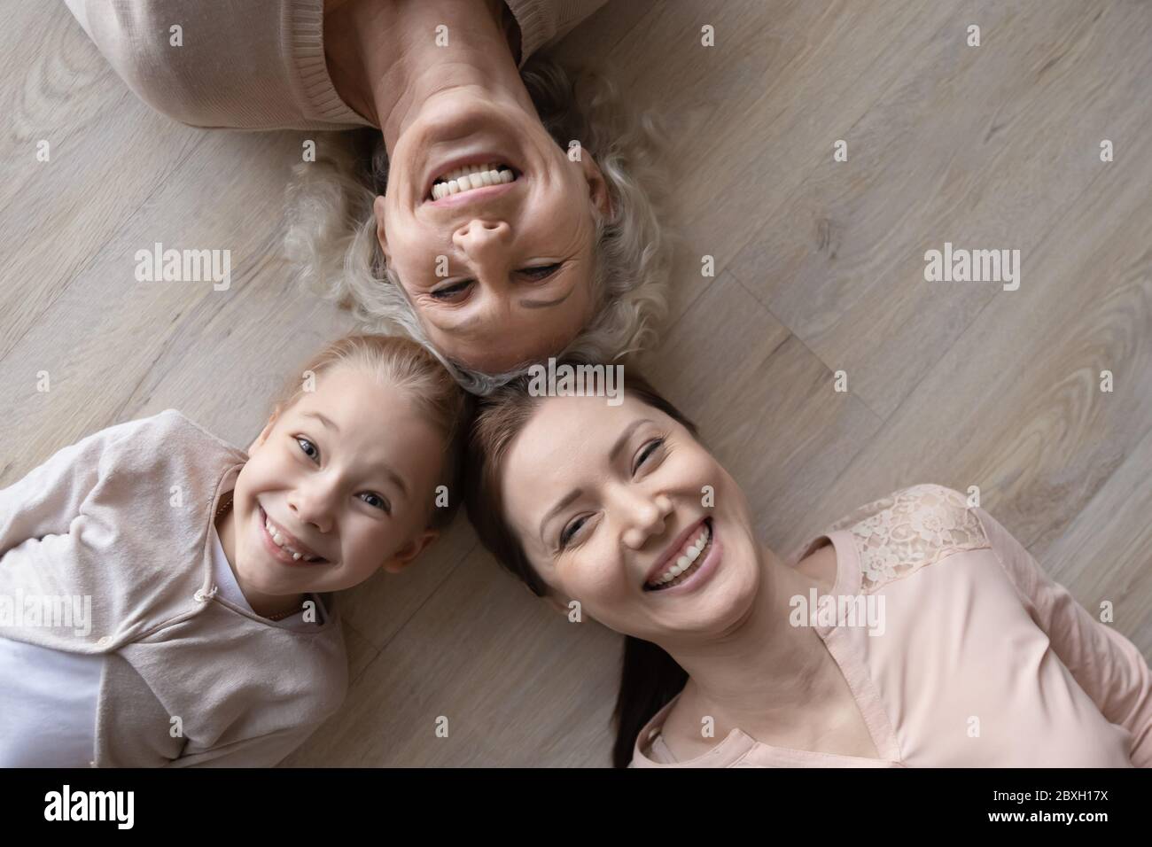 Top view portrait of smiling three generations of women Stock Photo - Alamy