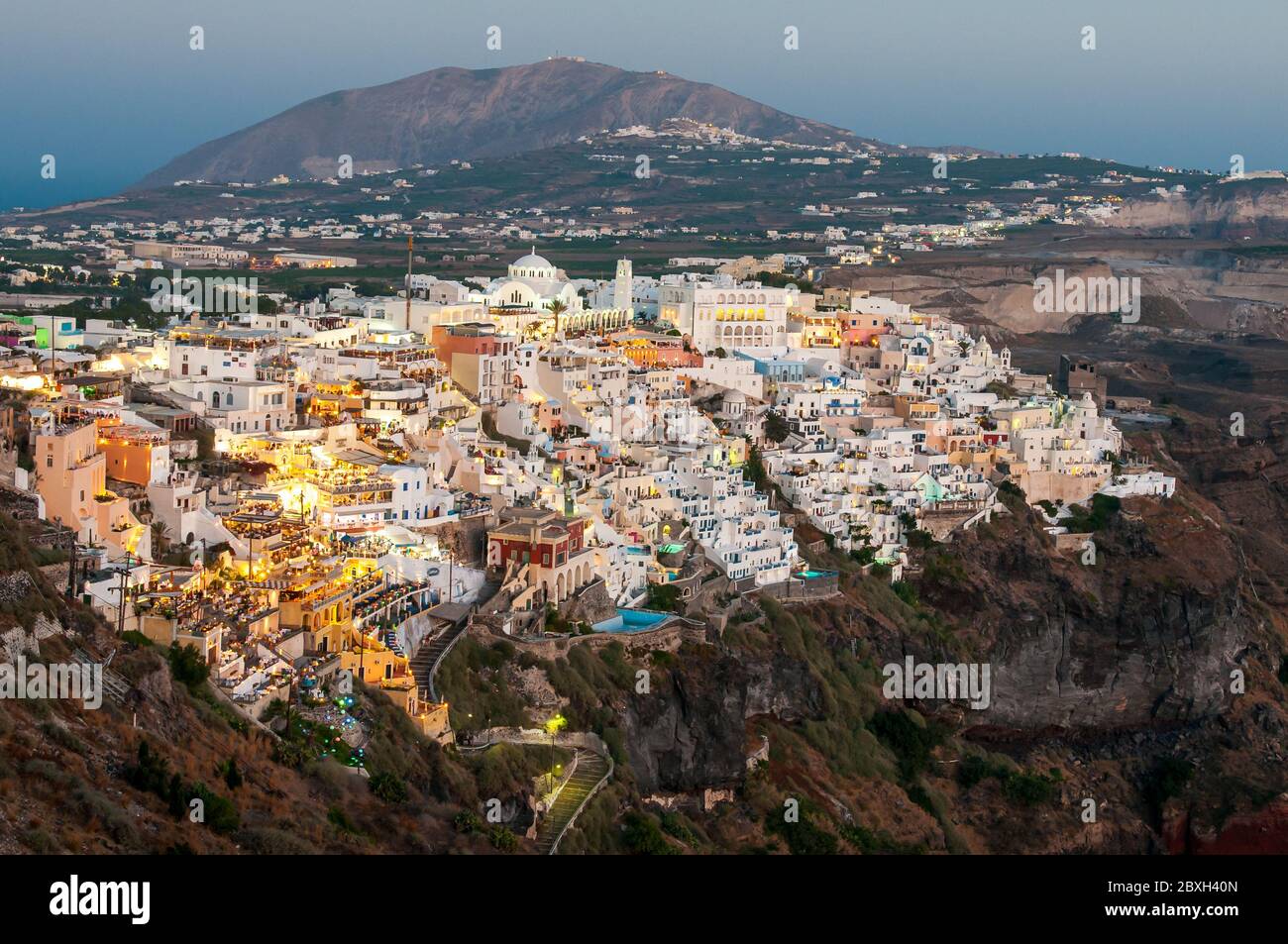 Cityscape of Fira town with white houses and the caldera in Santorini ...