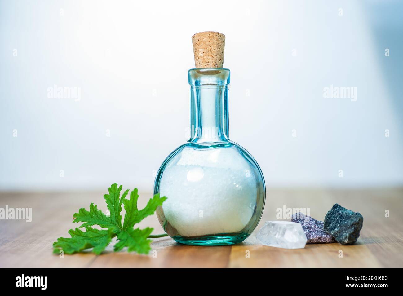 Sea salt in glass vile with cork lid Stock Photo - Alamy