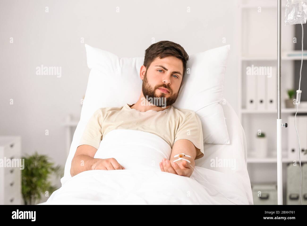 Young man in hospital room Stock Photo - Alamy