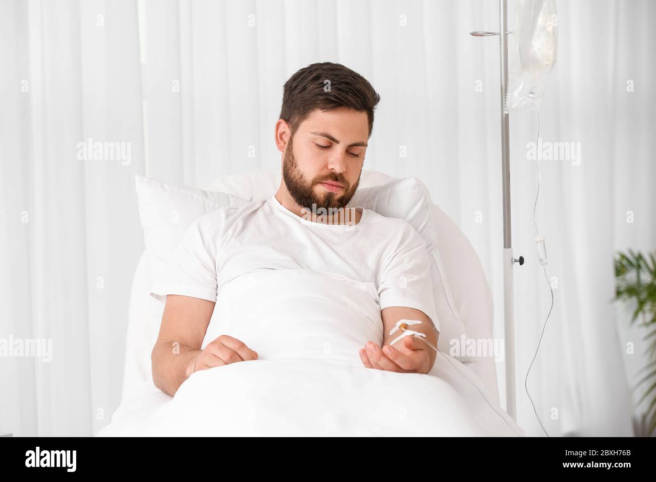 Young man in hospital room Stock Photo - Alamy