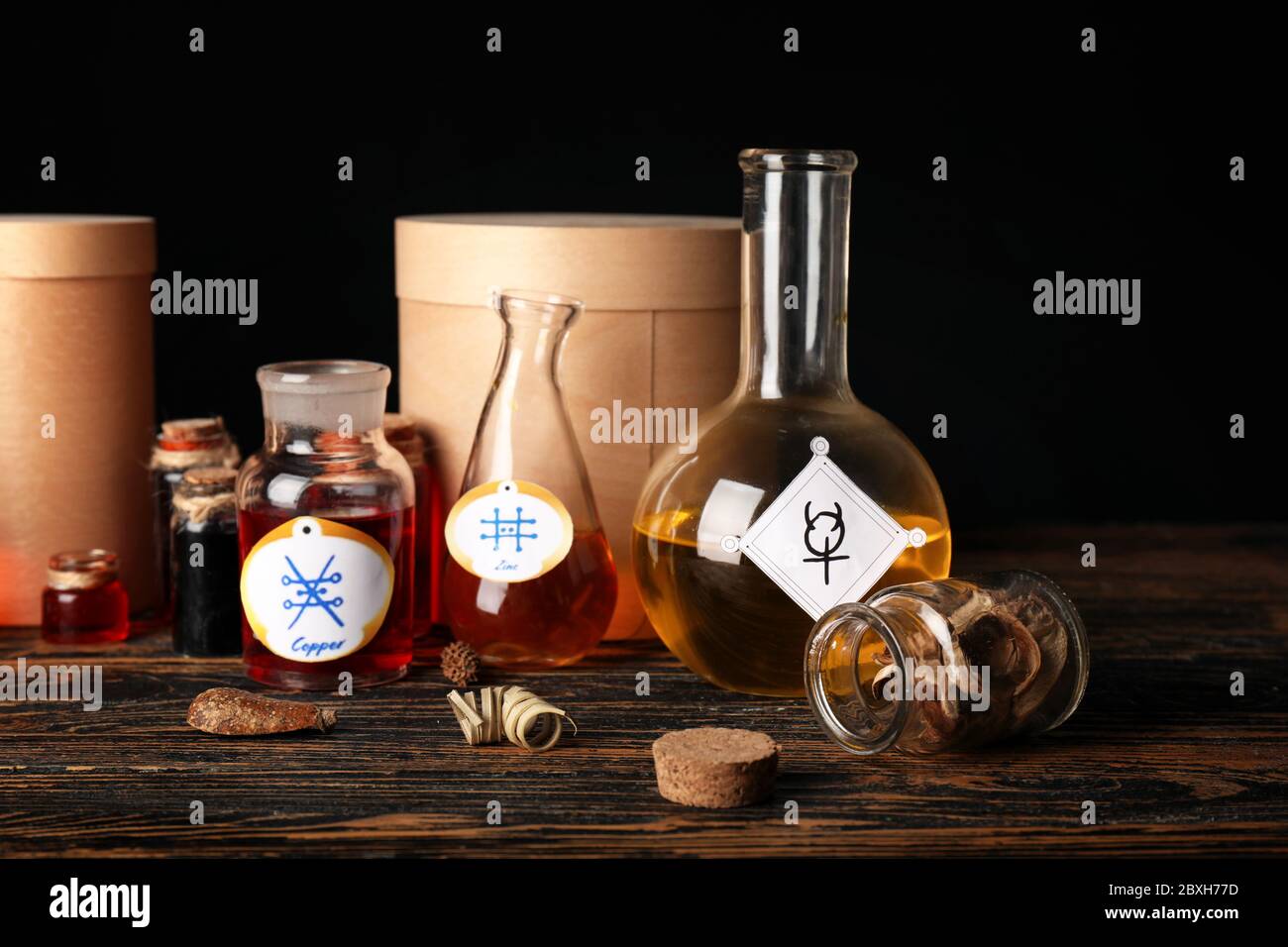 Different potions on alchemist's table Stock Photo - Alamy