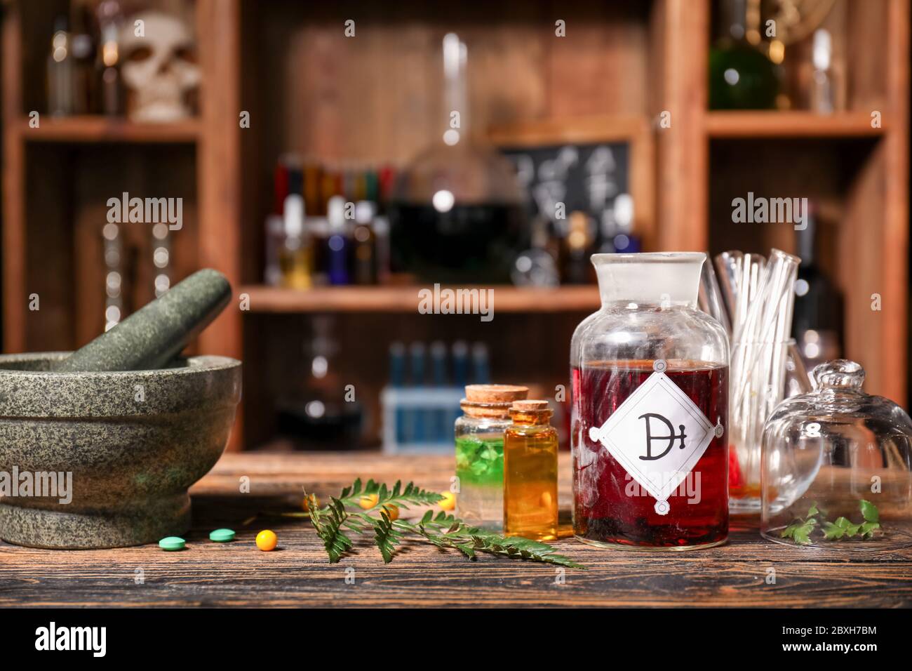 Different potions on table in alchemist's laboratory Stock Photo - Alamy