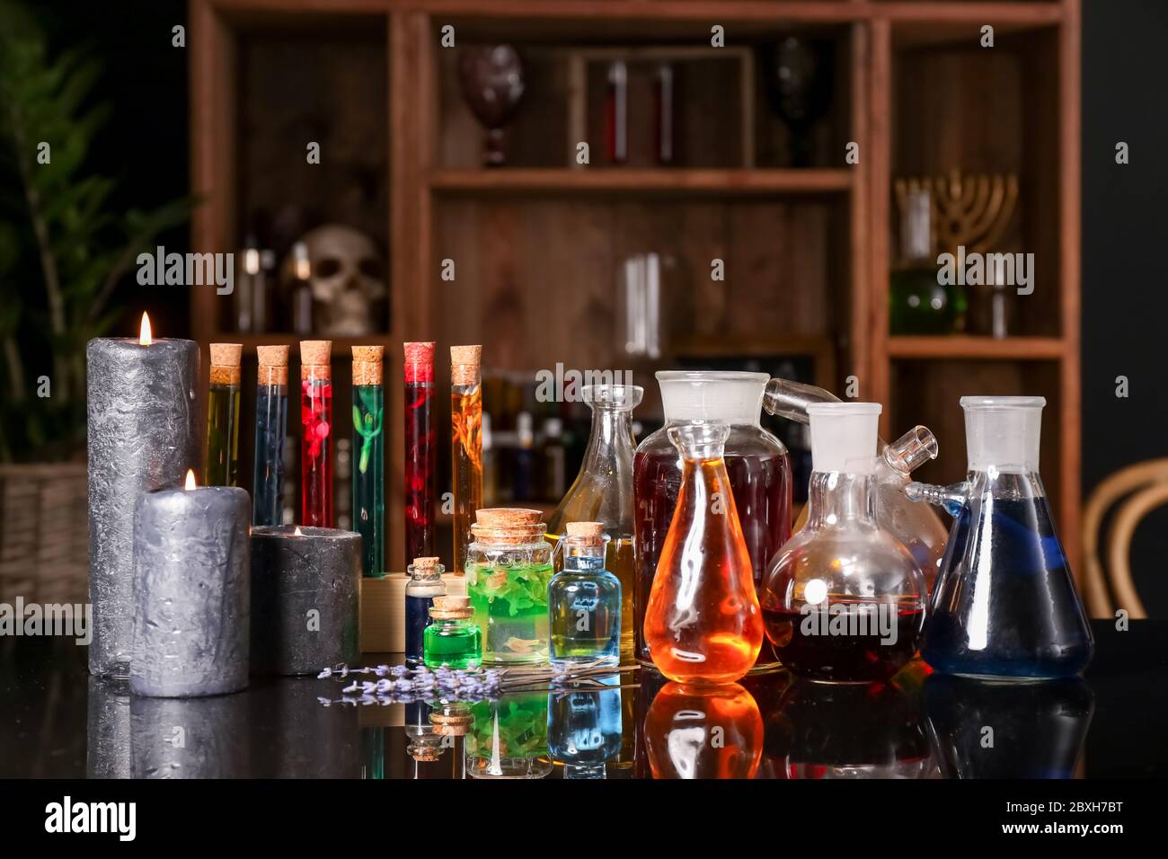 Different potions on alchemist's table Stock Photo - Alamy
