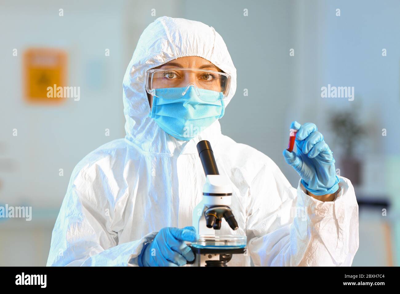 Scientist working with microscope in laboratory Stock Photo - Alamy
