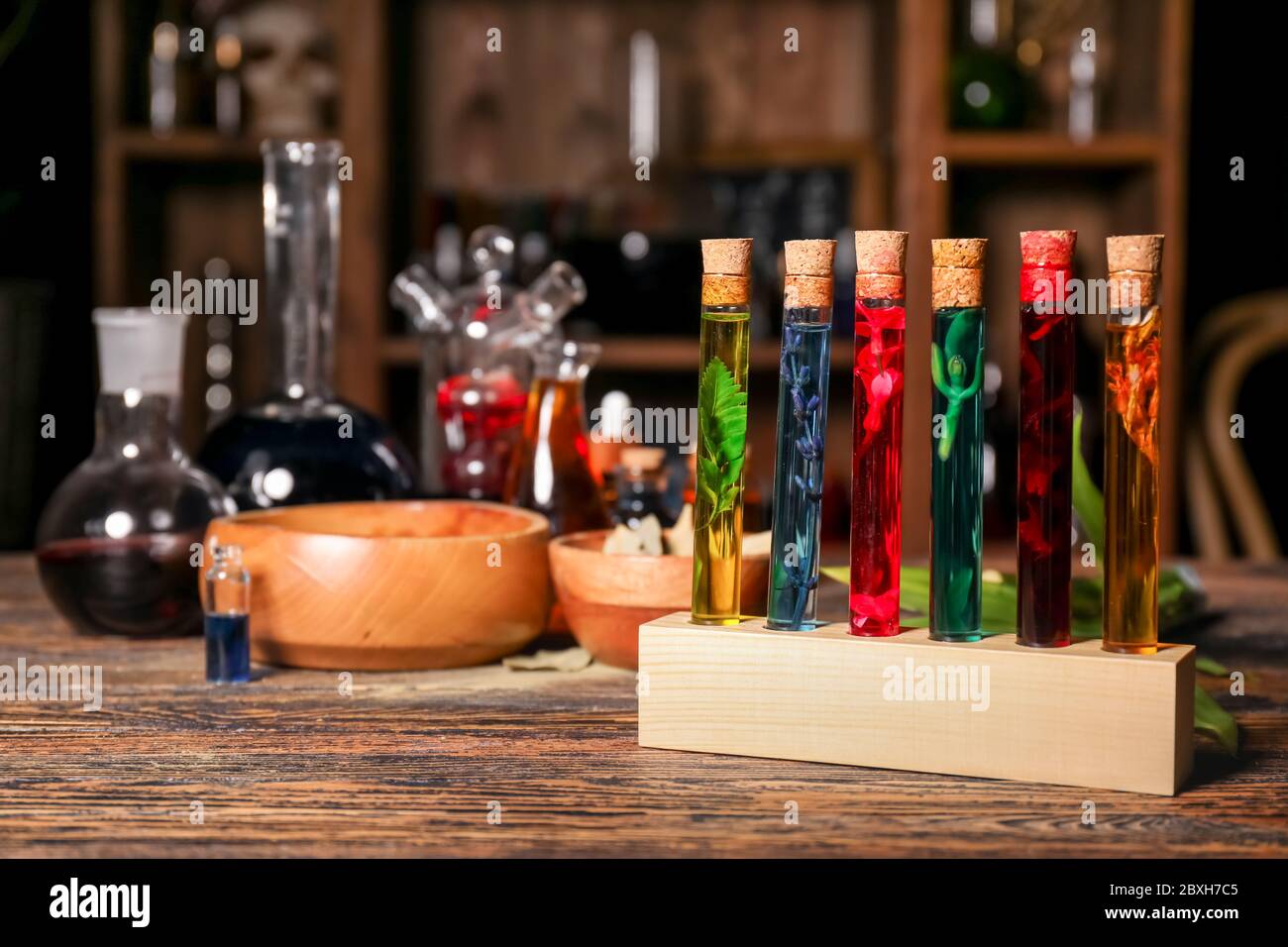 Different potions on alchemist's table Stock Photo - Alamy
