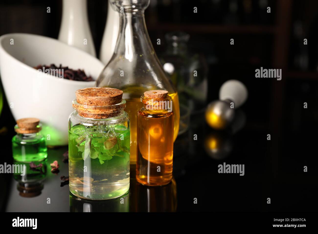 Different potions on alchemist's table Stock Photo - Alamy