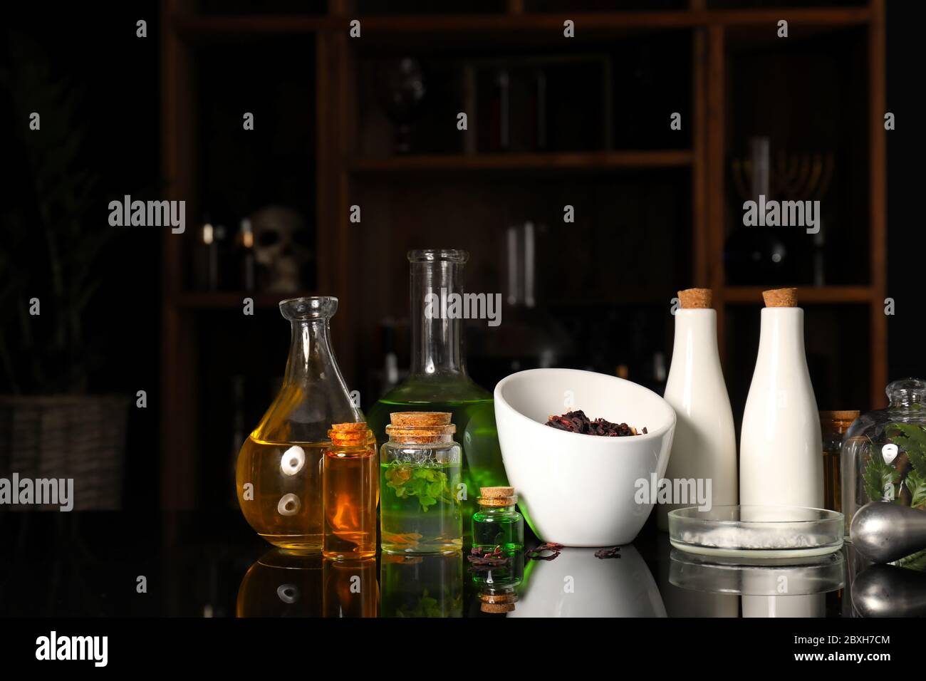 Different potions on alchemist's table Stock Photo - Alamy
