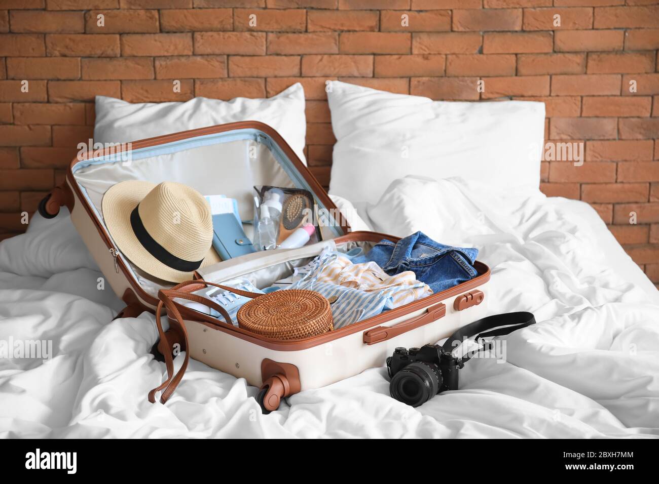 Packed suitcase open bed hi-res stock photography and images - Alamy