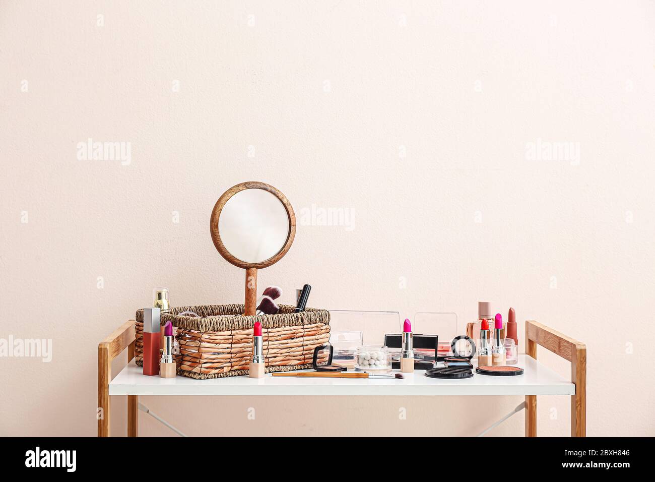 Table with set of decorative cosmetics in room Stock Photo - Alamy
