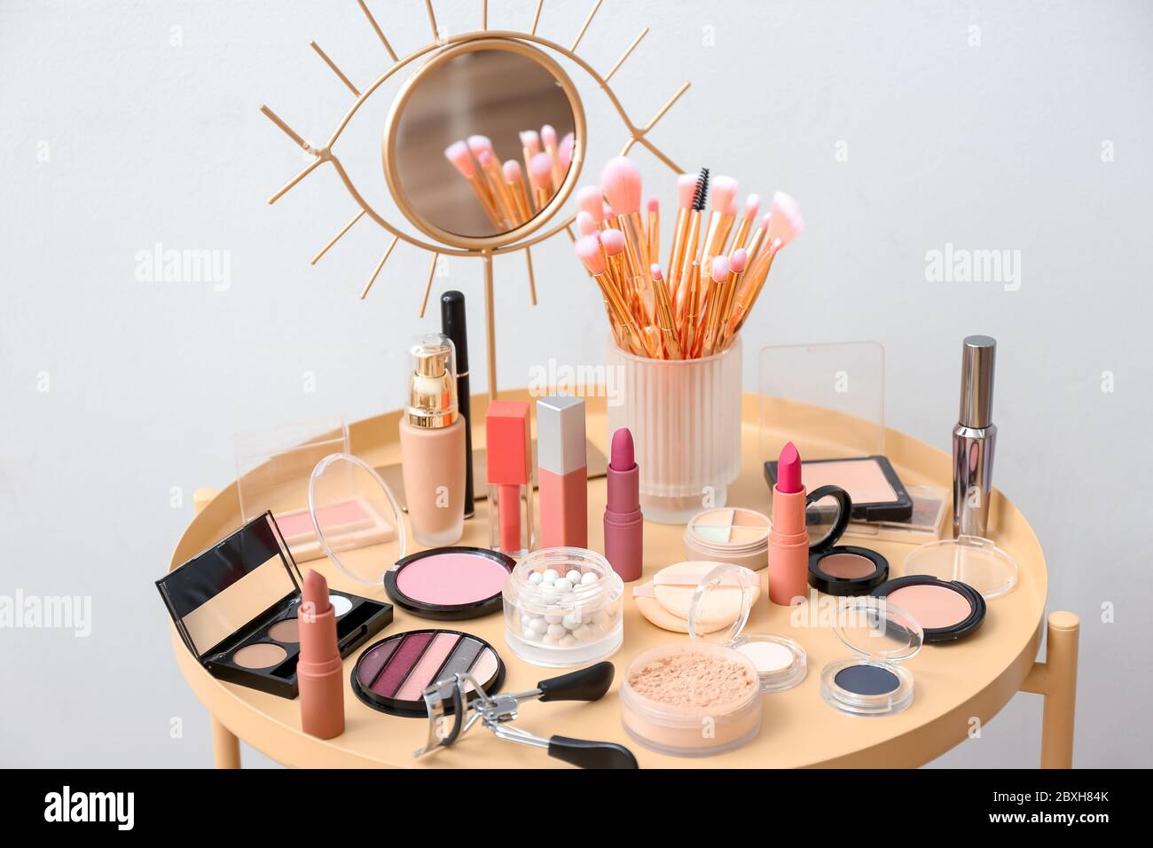 Set of decorative cosmetics on table Stock Photo - Alamy