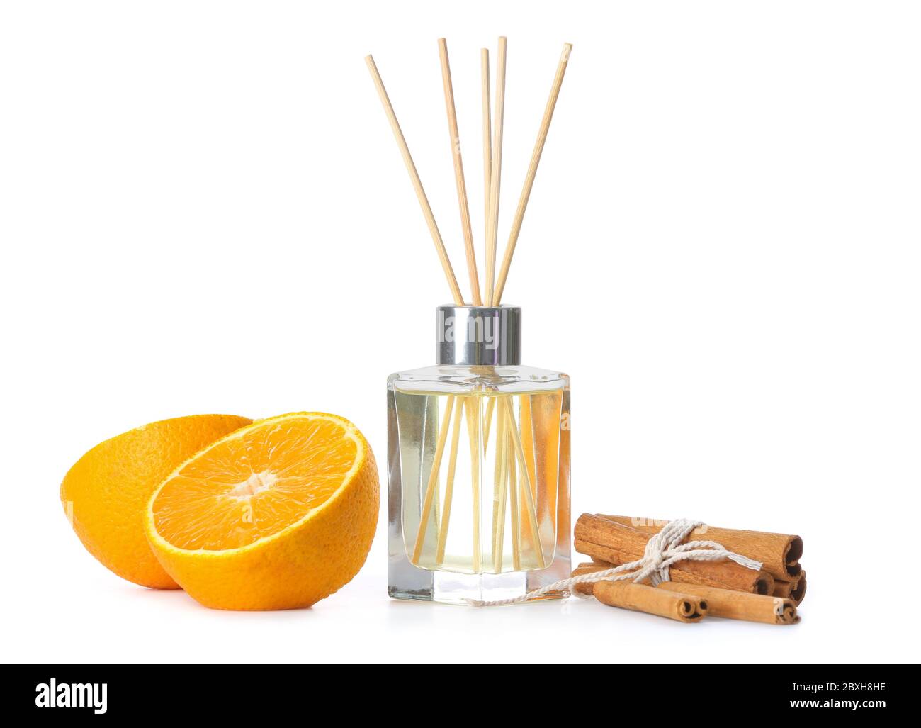 Reed diffuser, orange and cinnamon on white background Stock Photo - Alamy