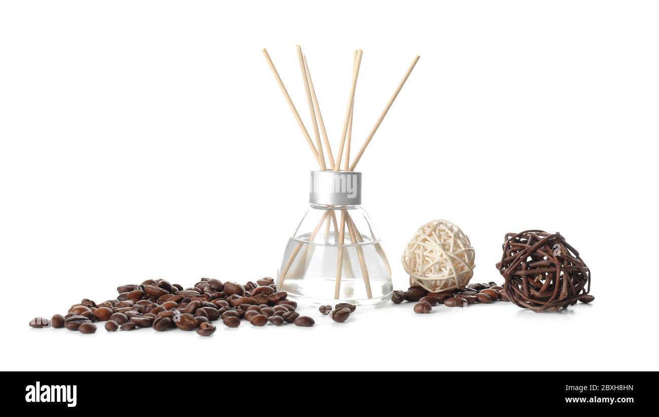 Reed diffuser and coffee beans on white background Stock Photo - Alamy