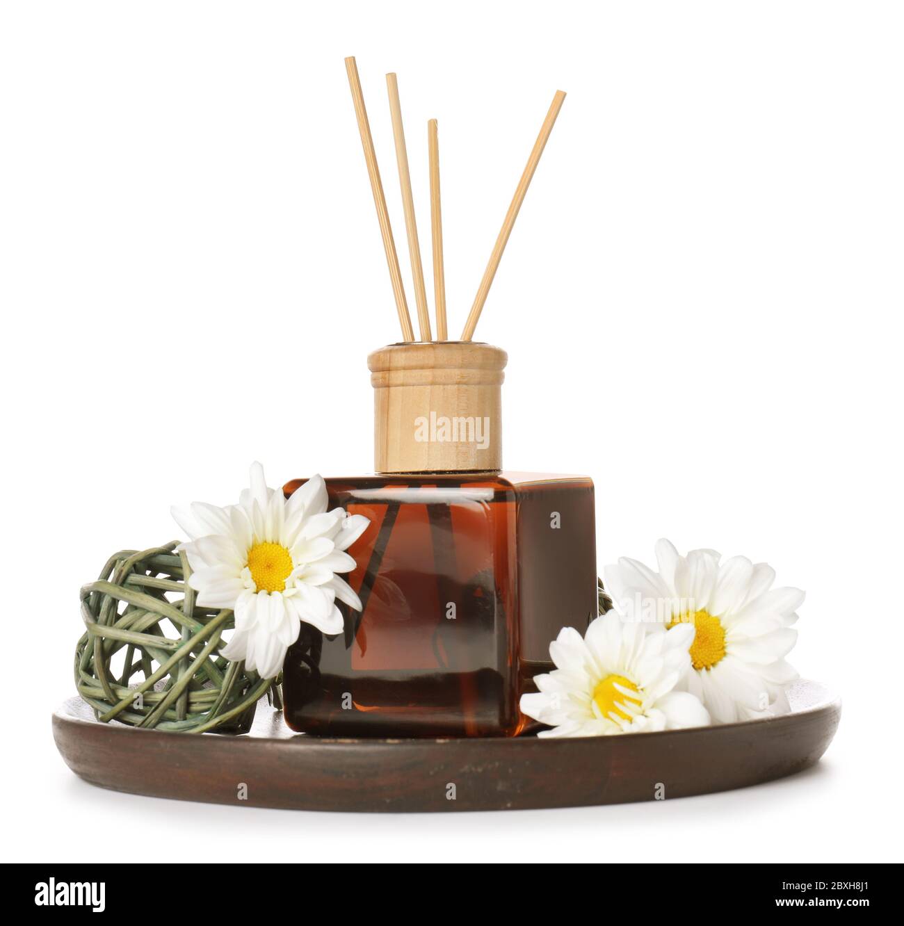 Reed diffuser and flowers on white background Stock Photo - Alamy
