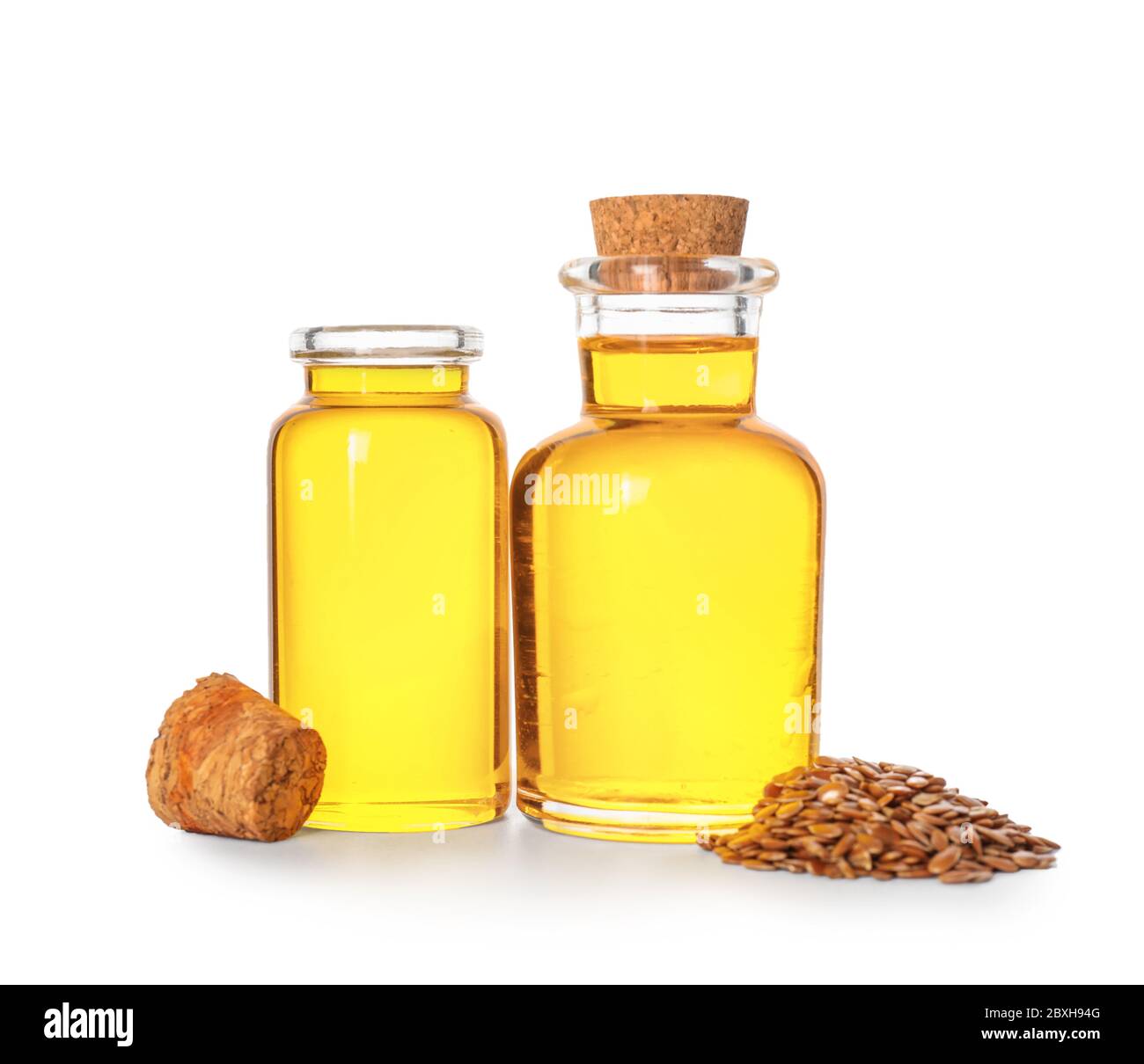 Bottles of flax oil on white background Stock Photo - Alamy