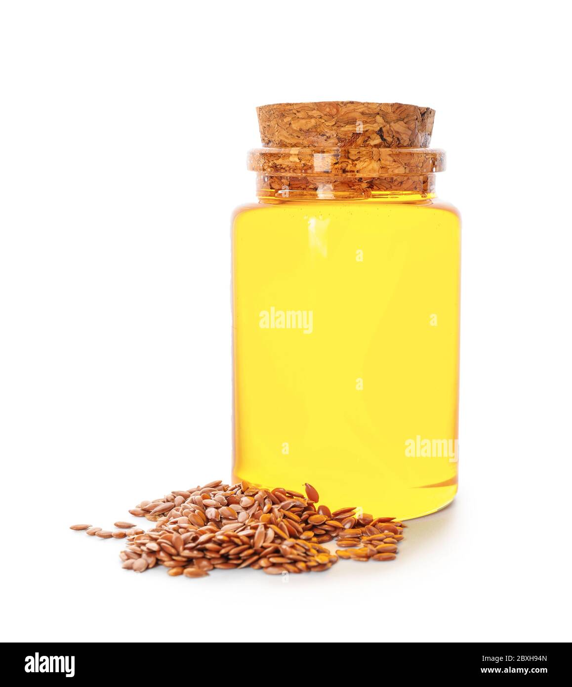 Bottle of flax oil on white background Stock Photo - Alamy