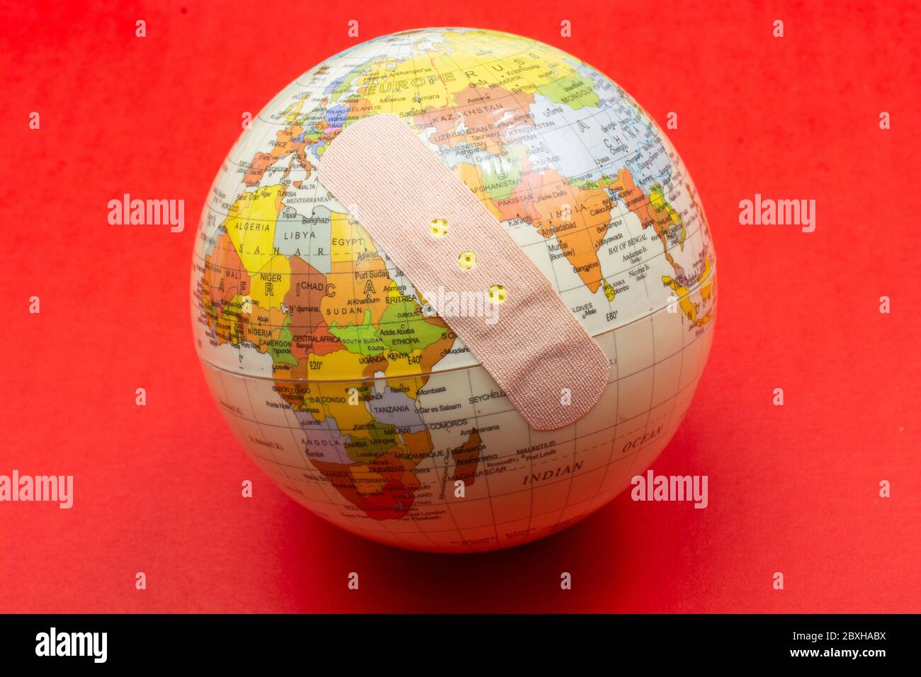 earth with bandaid Solidarity and aid to countries in need concept ...