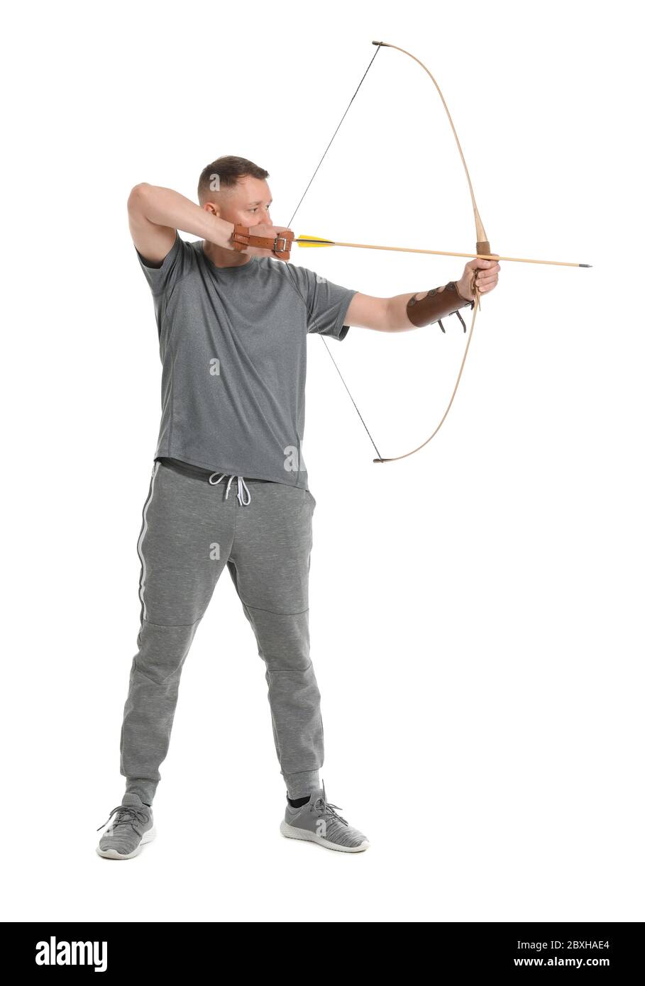 Handsome male archer with bow on white background Stock Photo - Alamy