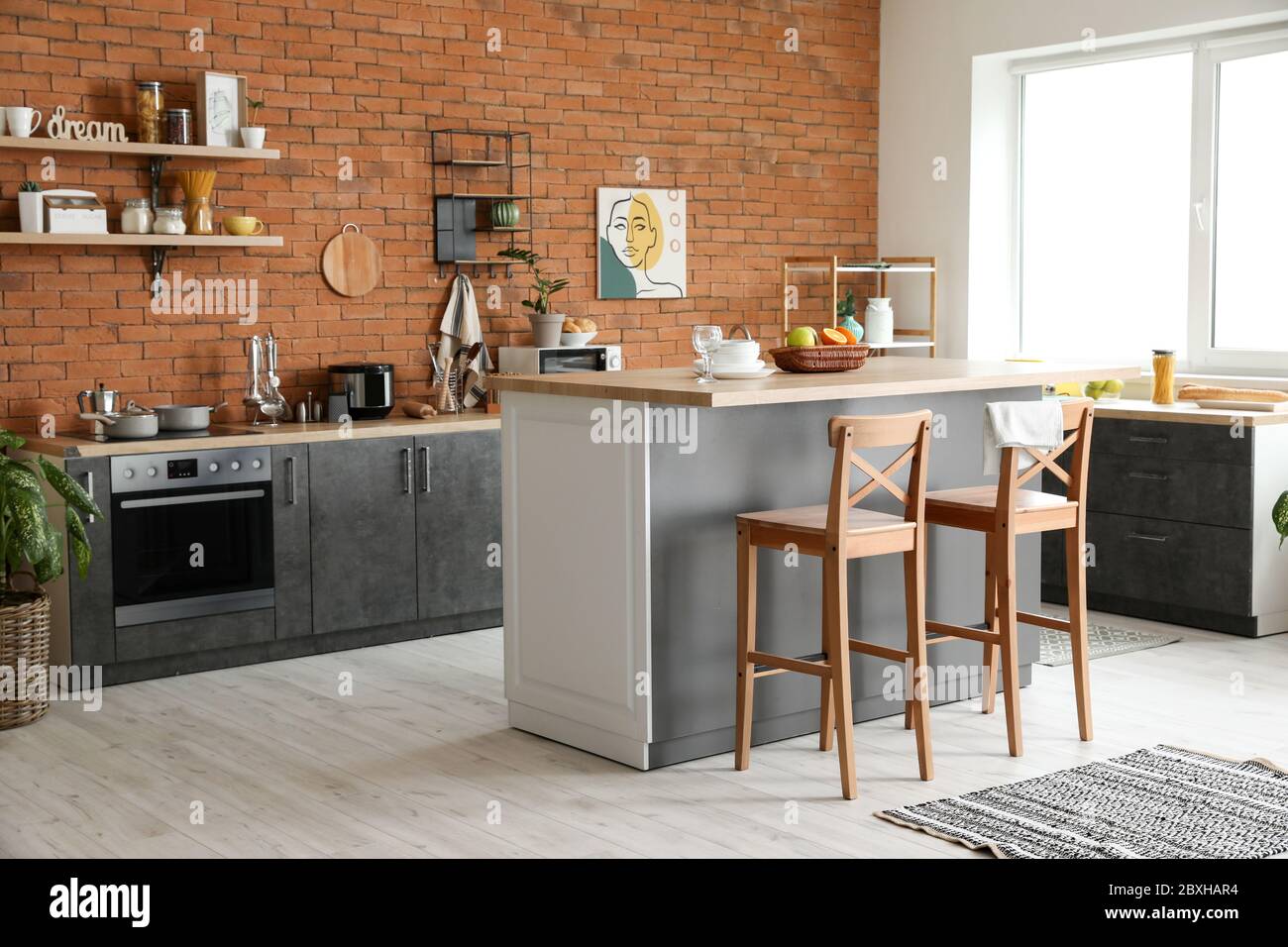 Interior of modern kitchen with stylish table Stock Photo - Alamy