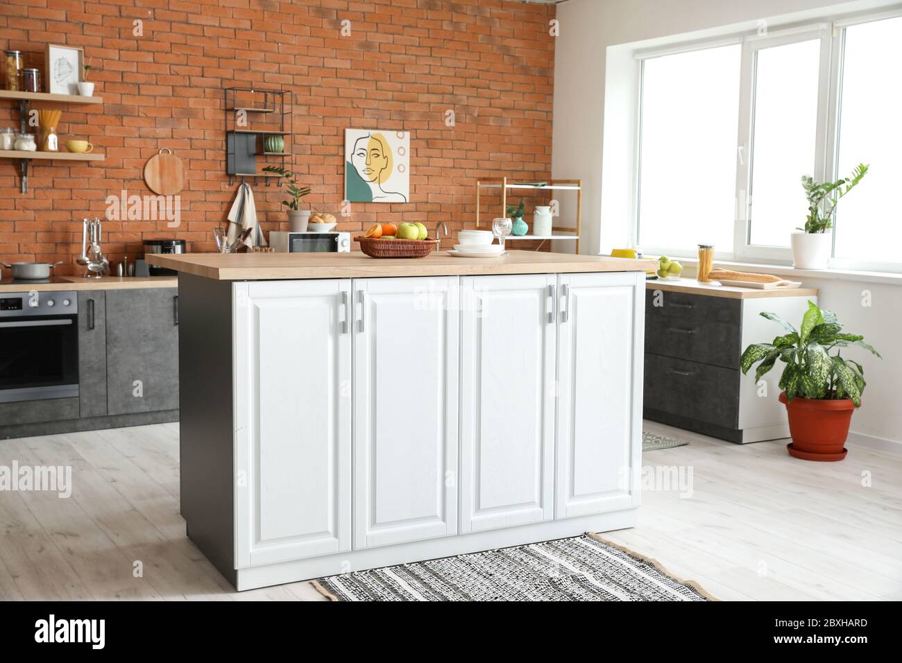Interior of modern kitchen with stylish table Stock Photo - Alamy