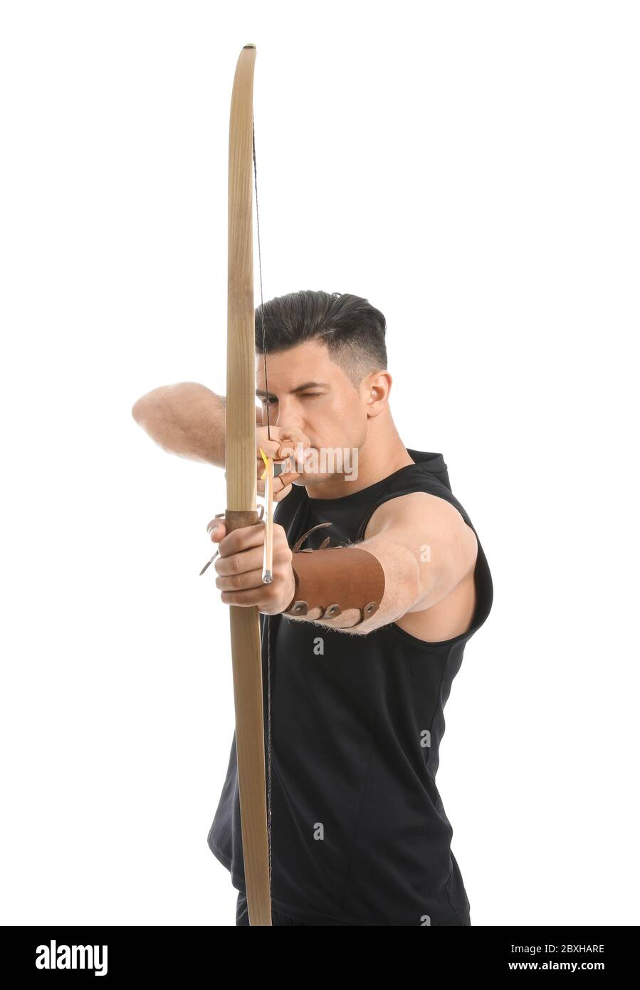 Handsome man with crossbow on white background Stock Photo - Alamy