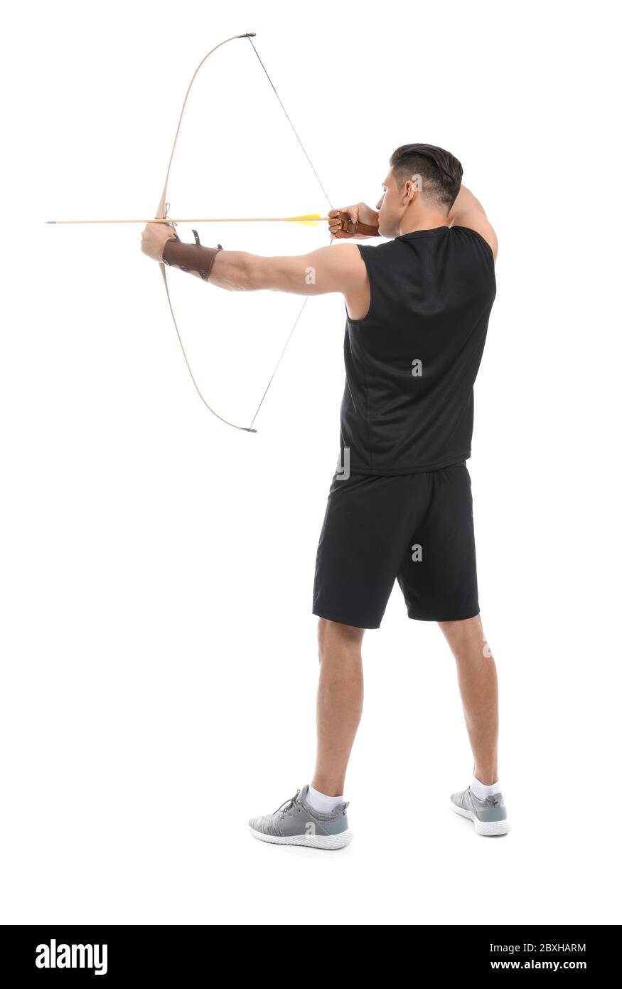 Handsome man with crossbow on white background Stock Photo - Alamy