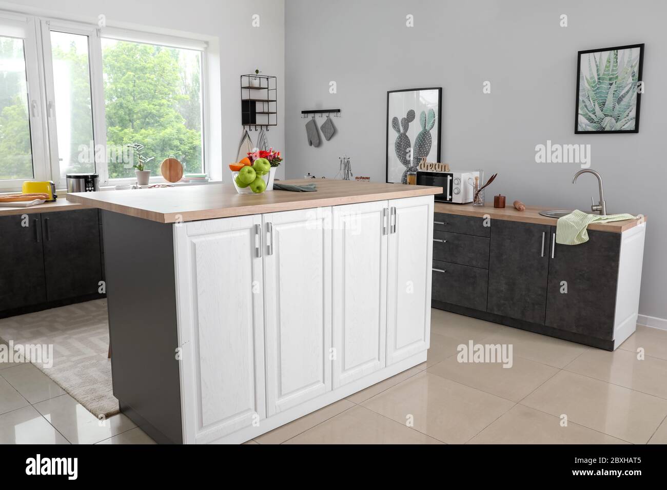 Interior of modern kitchen with stylish table Stock Photo - Alamy