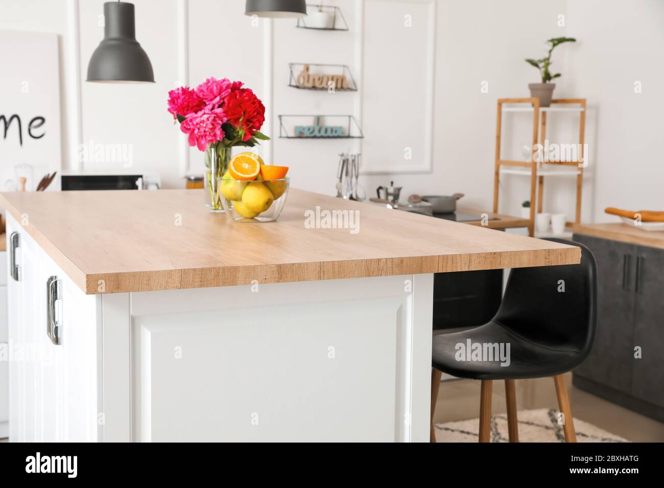 Stylish table in modern kitchen Stock Photo - Alamy
