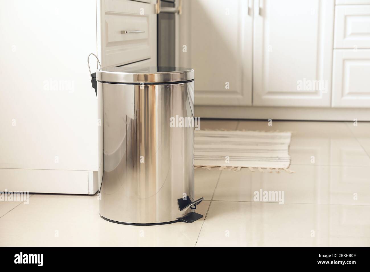 Clean trash bin in modern kitchen Stock Photo - Alamy